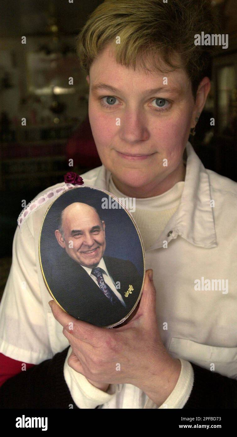 Linda Chapman holds a picture of her late husband, Carson Clay Chapman ...