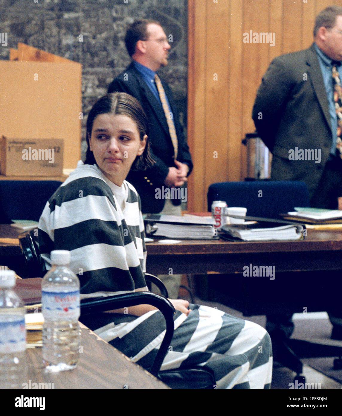 Lisa Gilbert, 20, looks back at family members during her arraignment ...