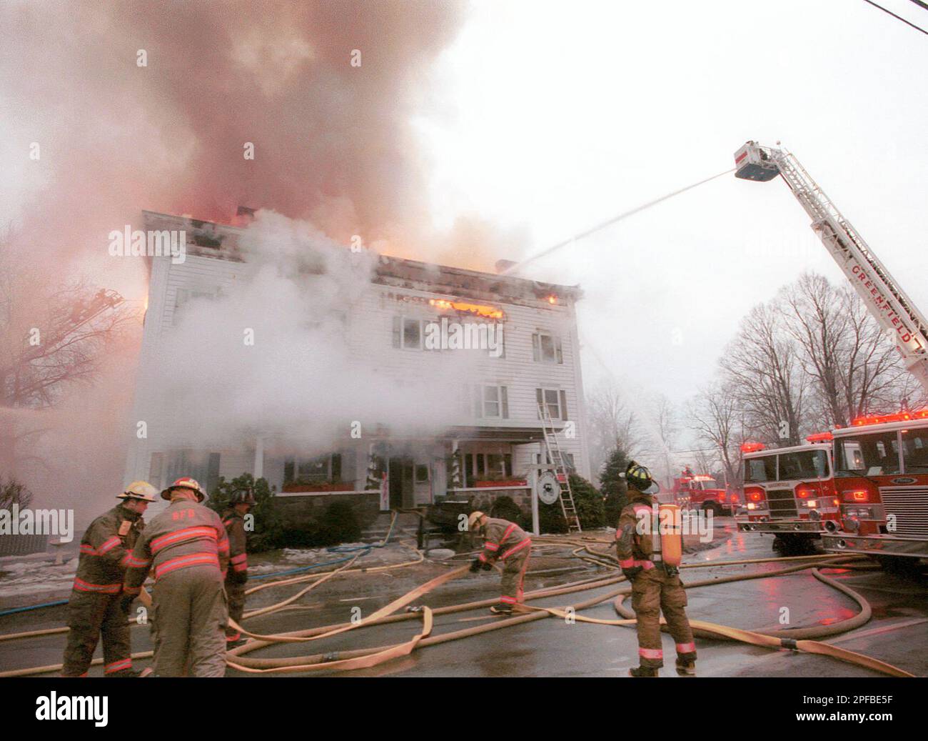 Firefighters from several area communities work to contain the early ...