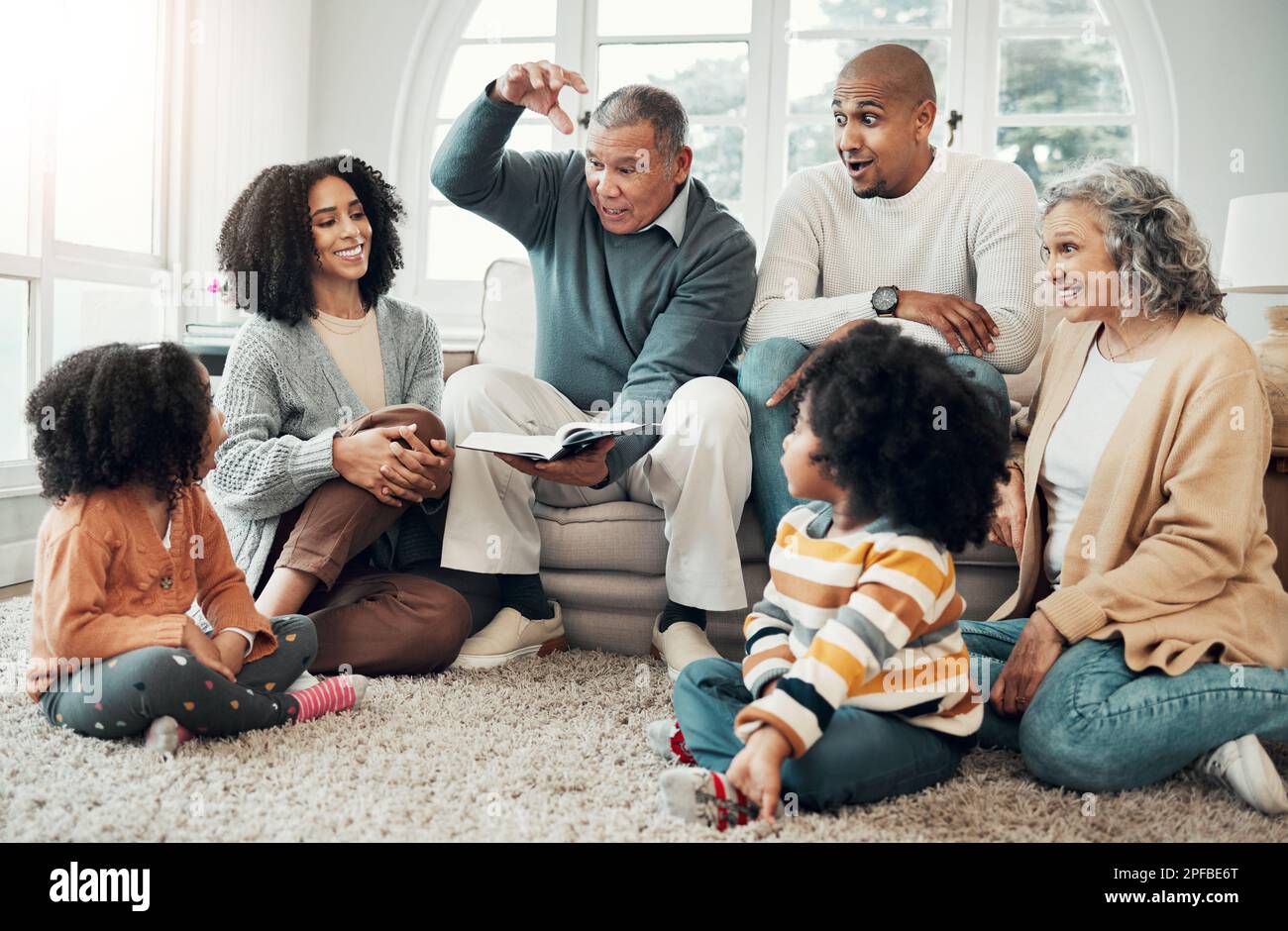 Family relax, surprise with fantasy and reading book, grandparents with ...