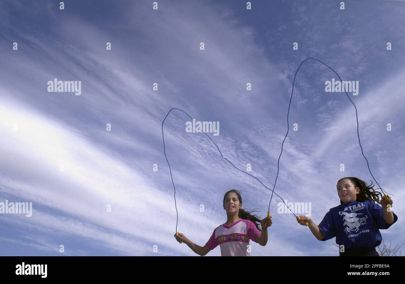 Janelle Saiz, 11, left, and Frances Ramirez, 9, right, both students at ...