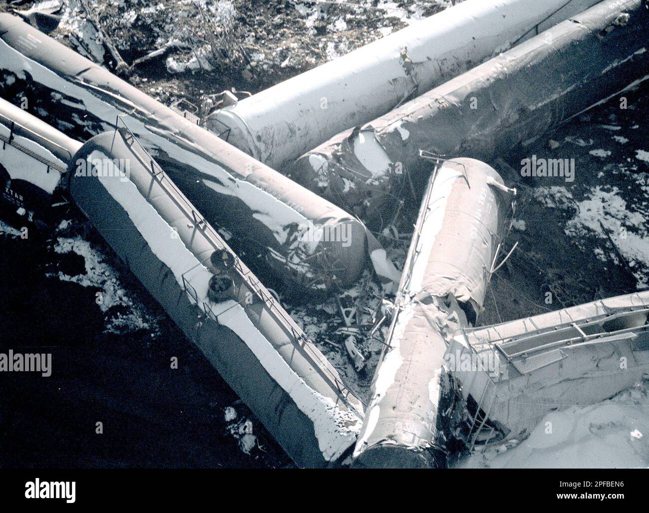 Destroyed rail cars and debris wait Monday, Jan. 21, 2002, in Minot, N ...