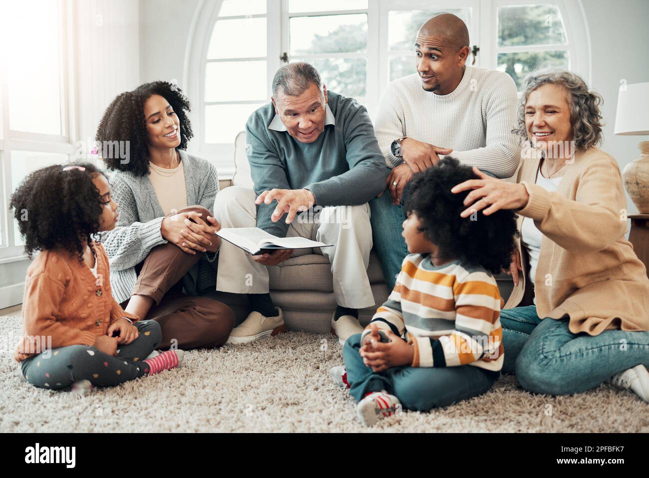 Family relax, generations with fantasy and reading book, grandparents ...