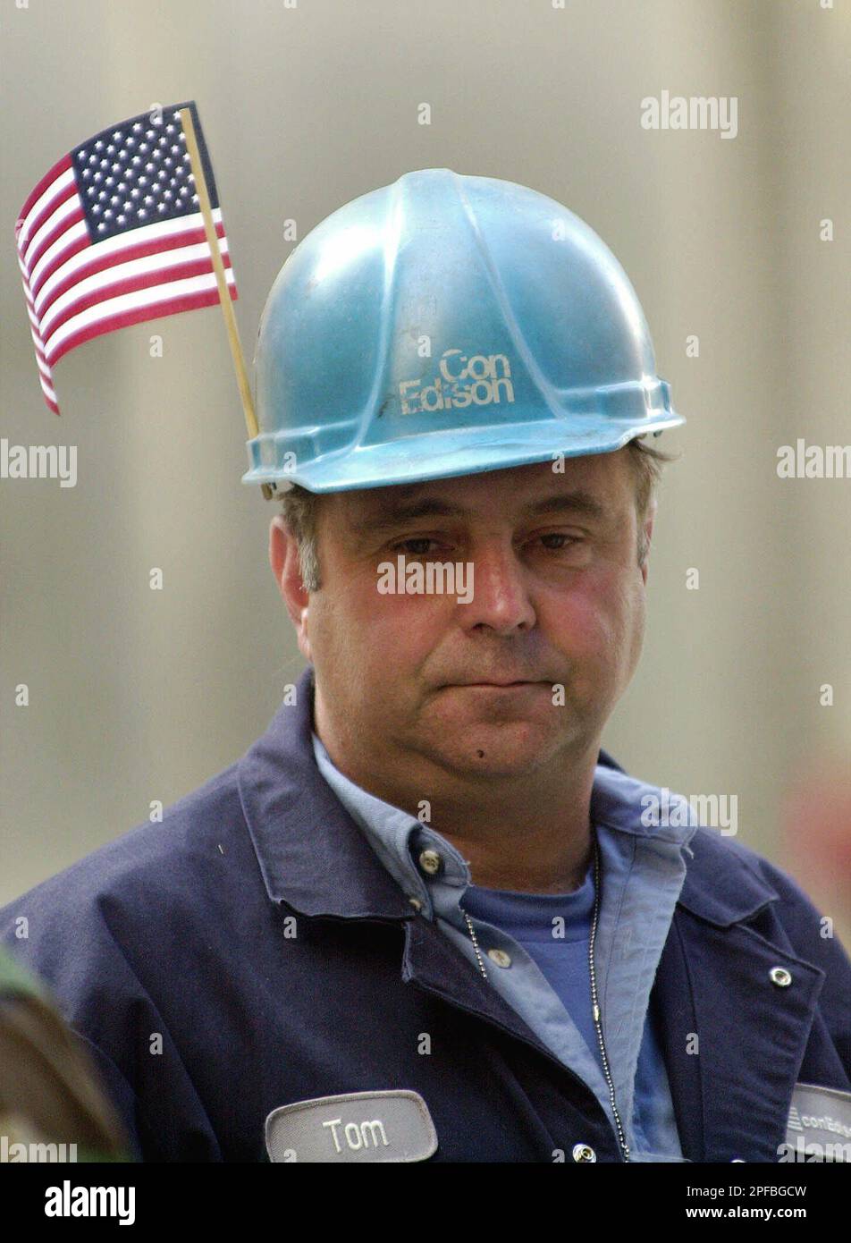 A Con Edison worker wears an American flag on his hard hat Monday, Sept ...