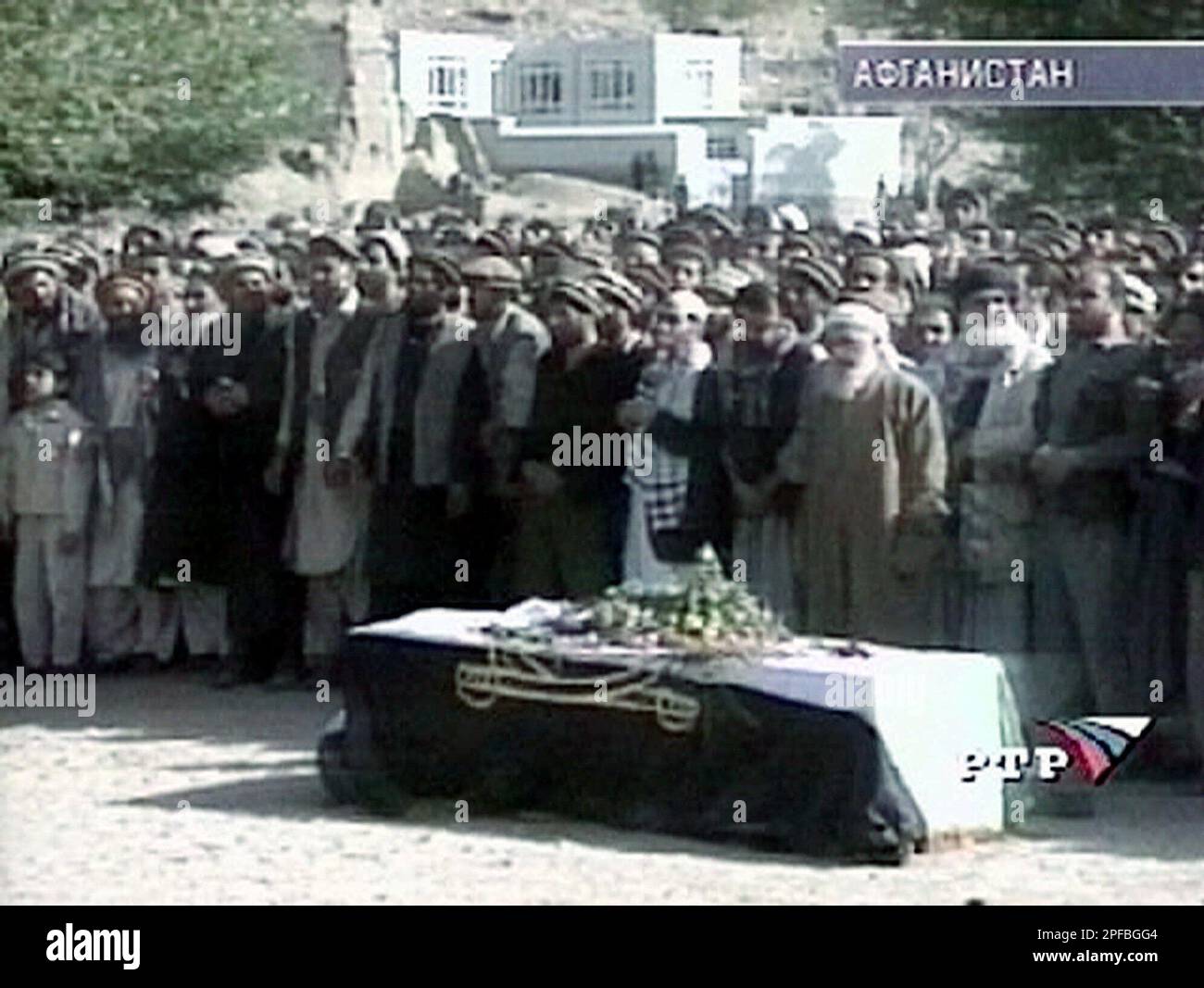 In this image from television thousands of people gather around the ...