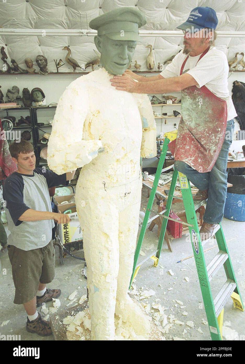 Beneath the clay bust of Dwight D. Eisenhower, Lawrence, Kan., sculptor ...