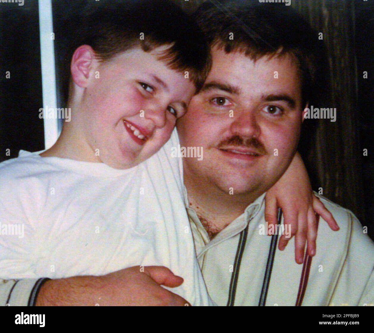Irving police officer Aubrey Hawkins is seen with his son in this ...