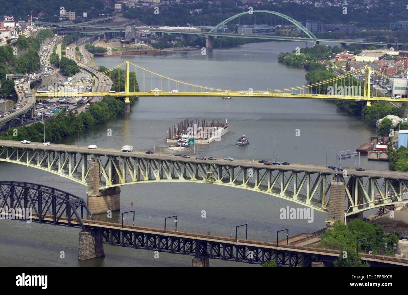 A 22 million pound segment of a modular dam is pushed under a series of ...