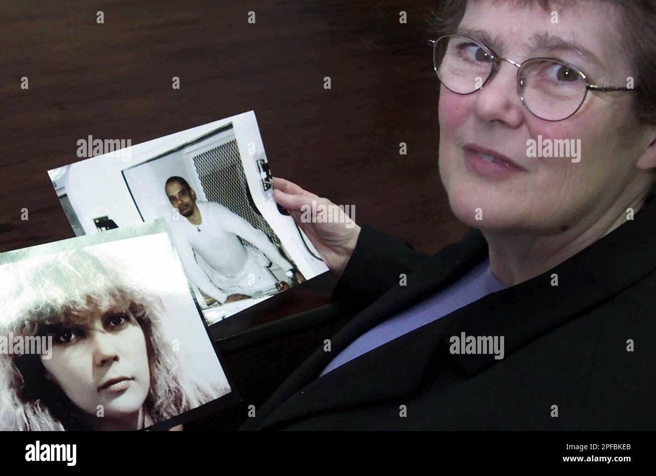 Lesley Moreland holds two photos, one of her daughter Ruth, left, who ...