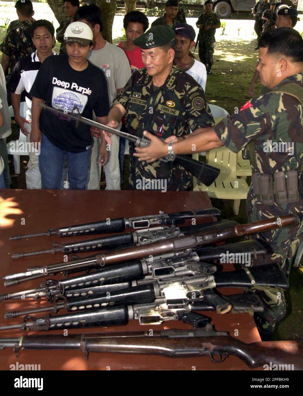Lt. Gen. Gregorio Camiling, center, Southern Command Chief, inspects a ...
