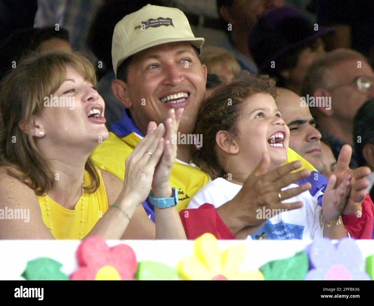 President Hugo Chavez, center, and his wife Marisabel Chavez with their ...
