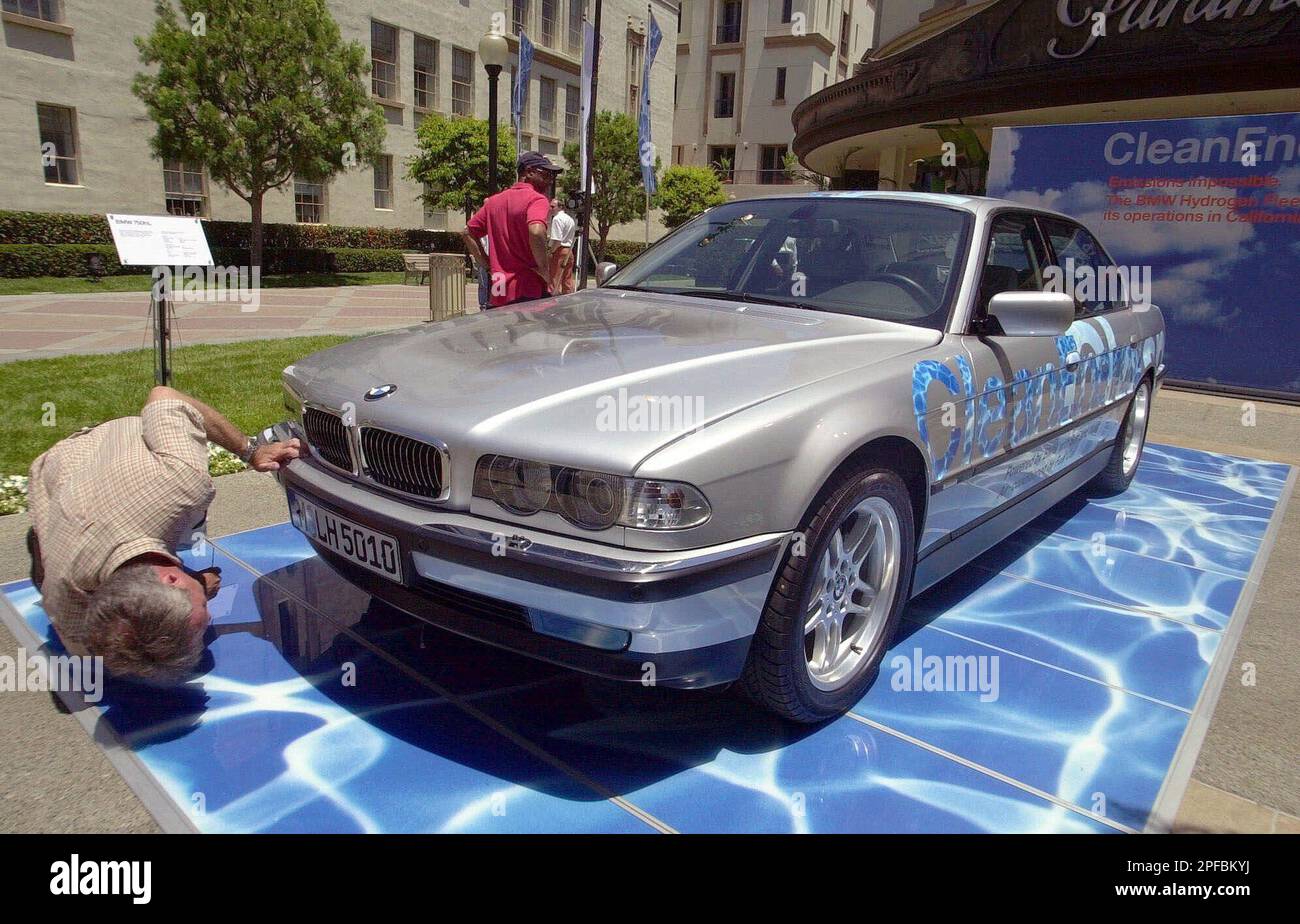Passerby Russ Rayburn looks under BMW's new silver 740hL hydrogen ...
