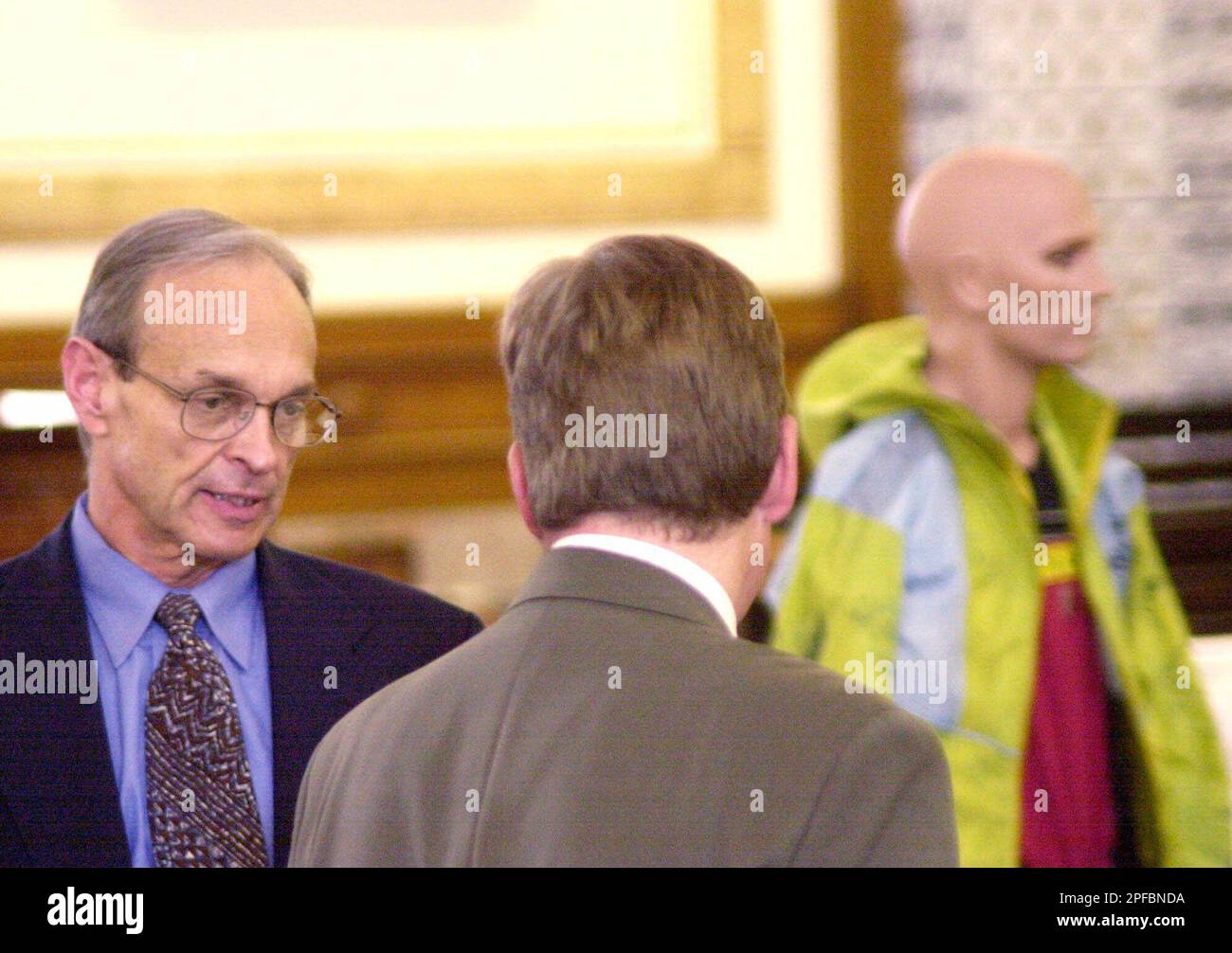 Dr. Dirk Greineder, left, confers with his attorney, Martin F. Murphy ...