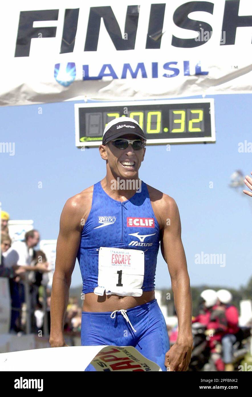 Chris McCormack of Australia smiles after winning the male division of ...