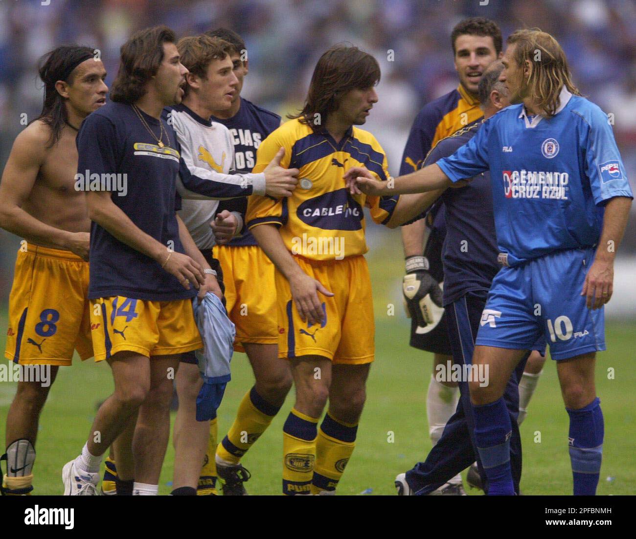 Cruz Azul soccer player Hector Adomaitis, right, trys to pick a fight ...