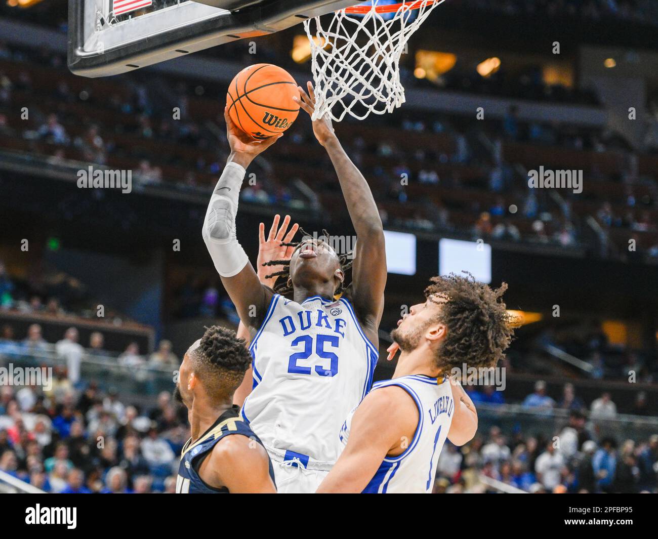 March 16, 2023: Duke Blue Devils forward Mark Mitchell (25) lays the ...