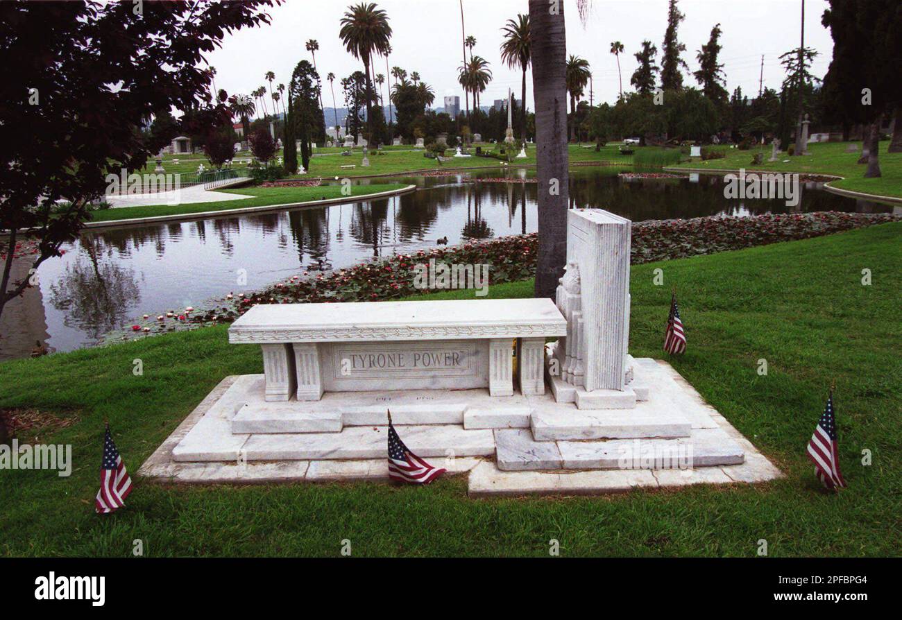 The grave sight of actor Tyrone Power is adorned with American flags at ...