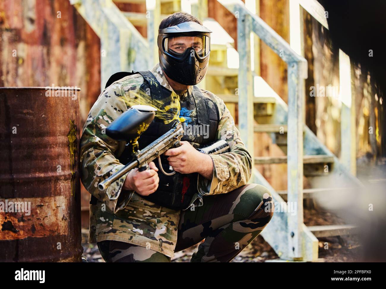 Paintball, portrait or male soldier with gun in shooting game playing ...