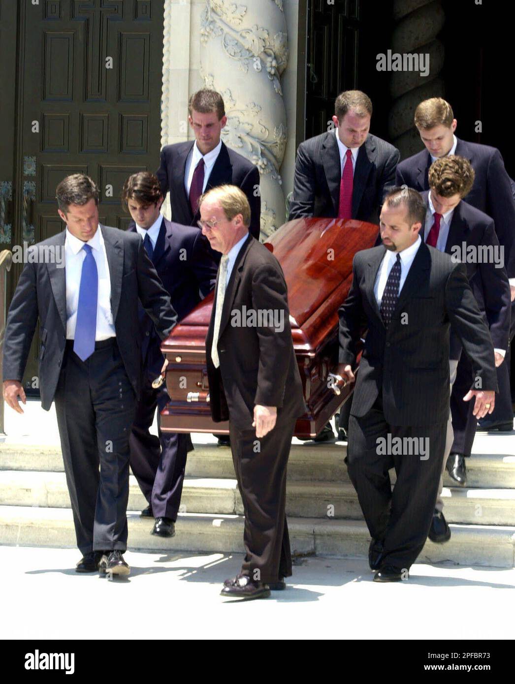 The casket bearing entertainer Perry Como is carried out of St. Edwards Church following his ...