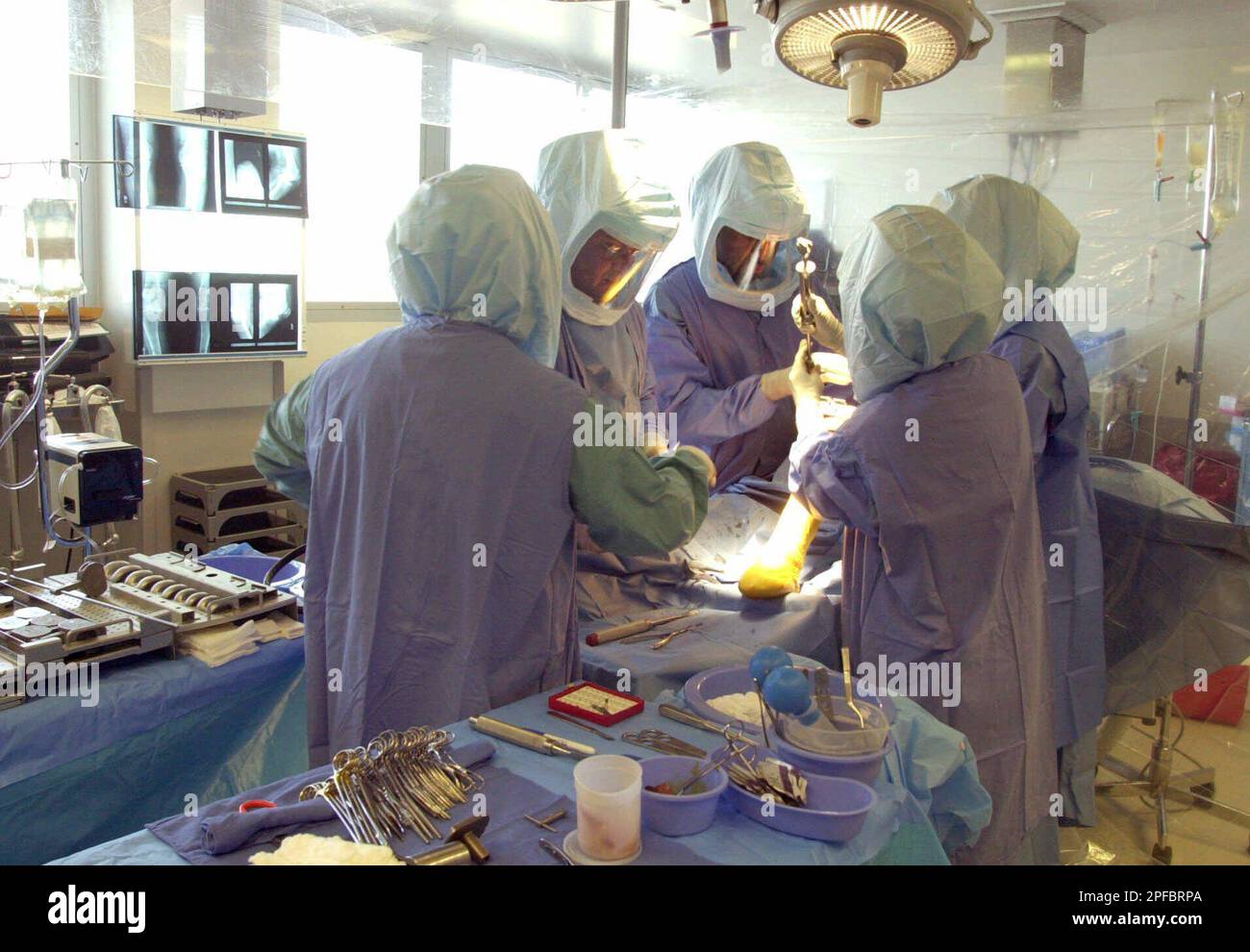 Dr. Robert E. Booth Jr., second from left, and his surgical team ...