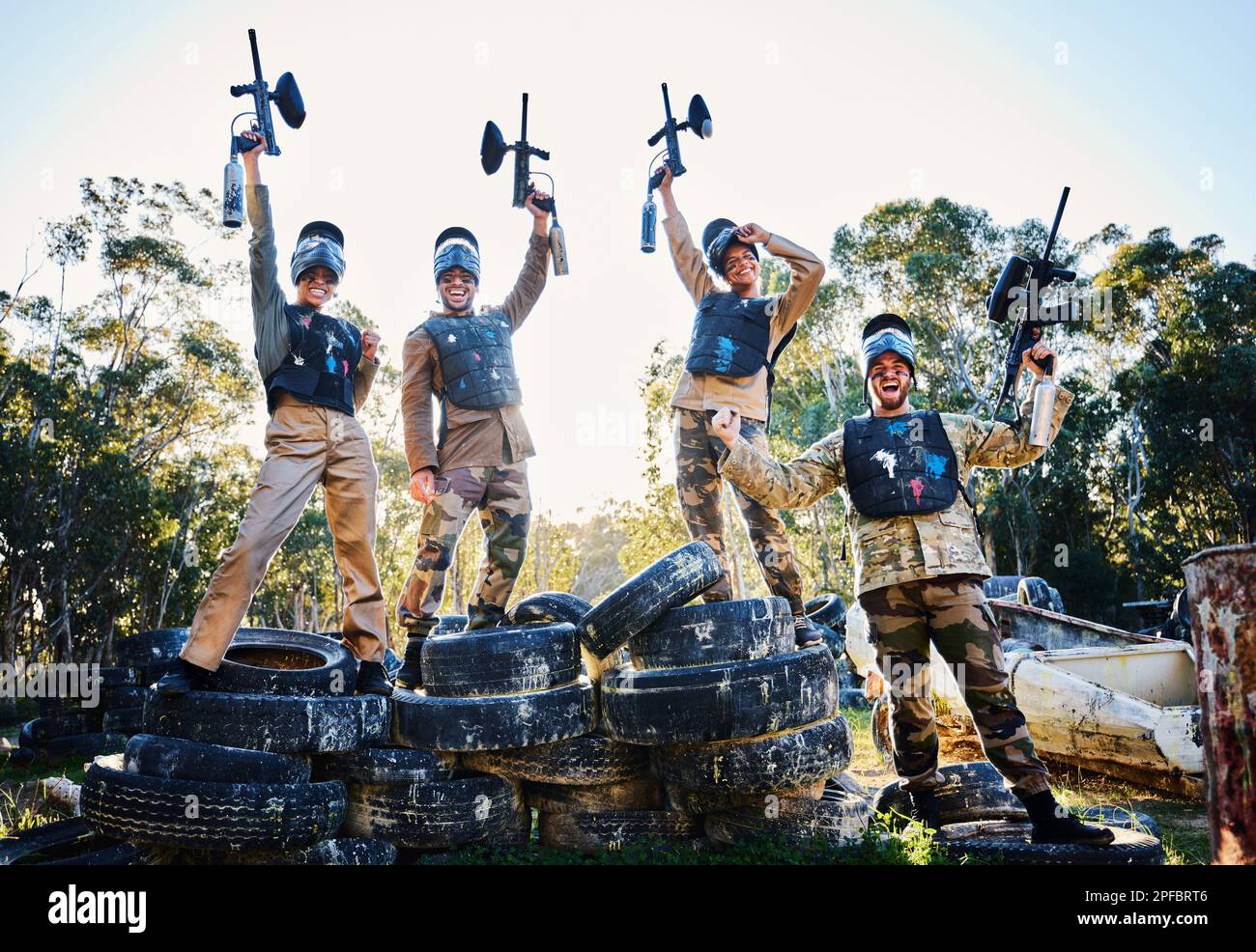 Team, paintball and portrait in celebration for winning, victory or ...