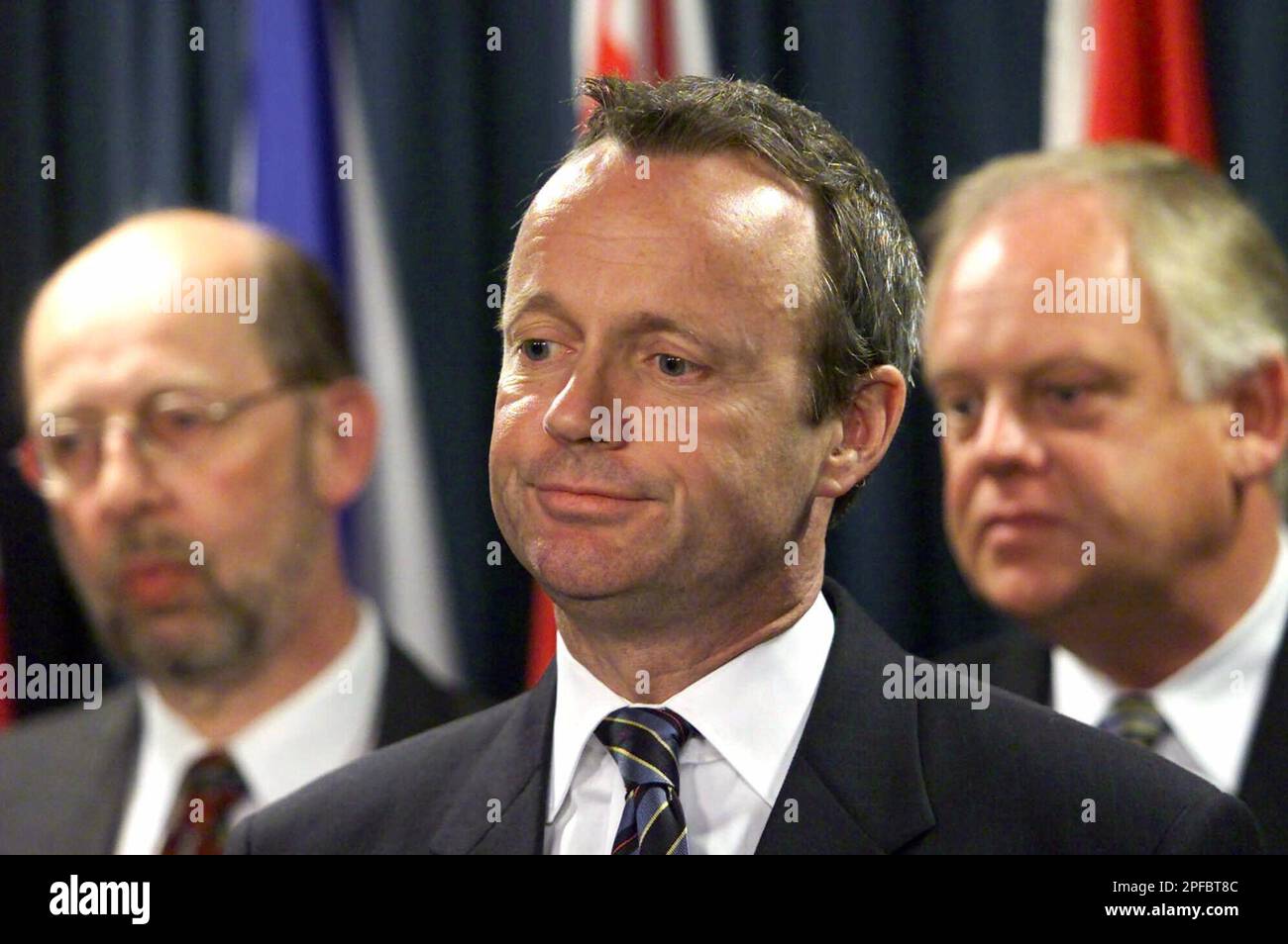 Canadian Alliance leader Stockwell Day talks with reporters following a ...