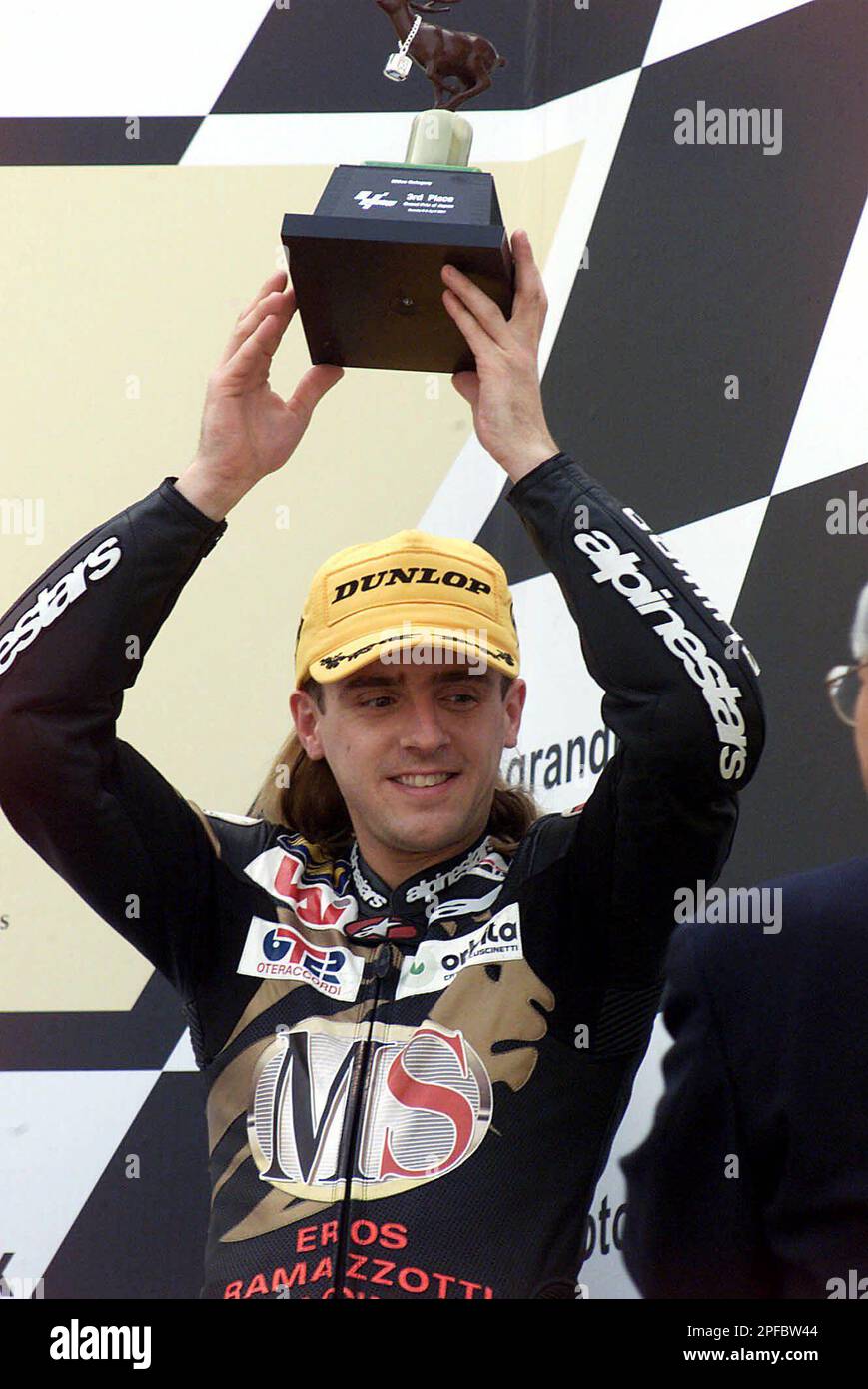 Roberto Locatelli of Italy holds his third place trophy aloft during ...