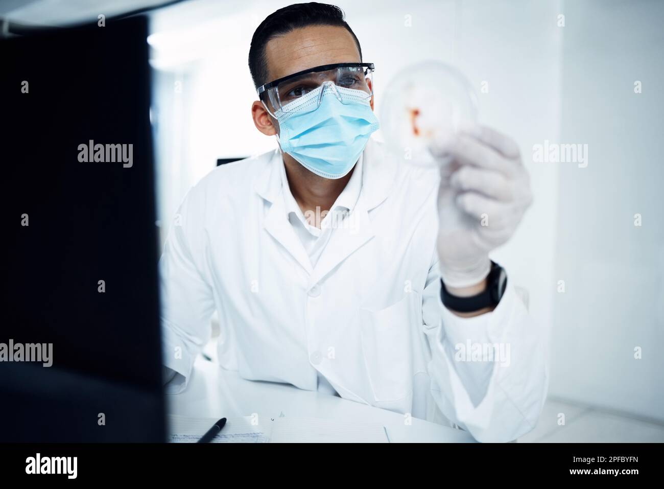 The master in making viruses disappear. a young scientist conducting ... The master in making viruses disappear. a young scientist conducting ...