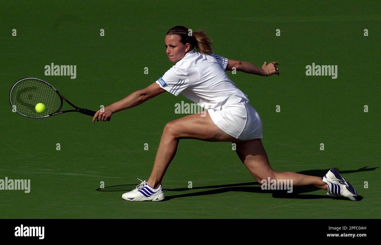 Anne Gaelle Sidot, of France, returns a shot to Lindsay Davenport ...