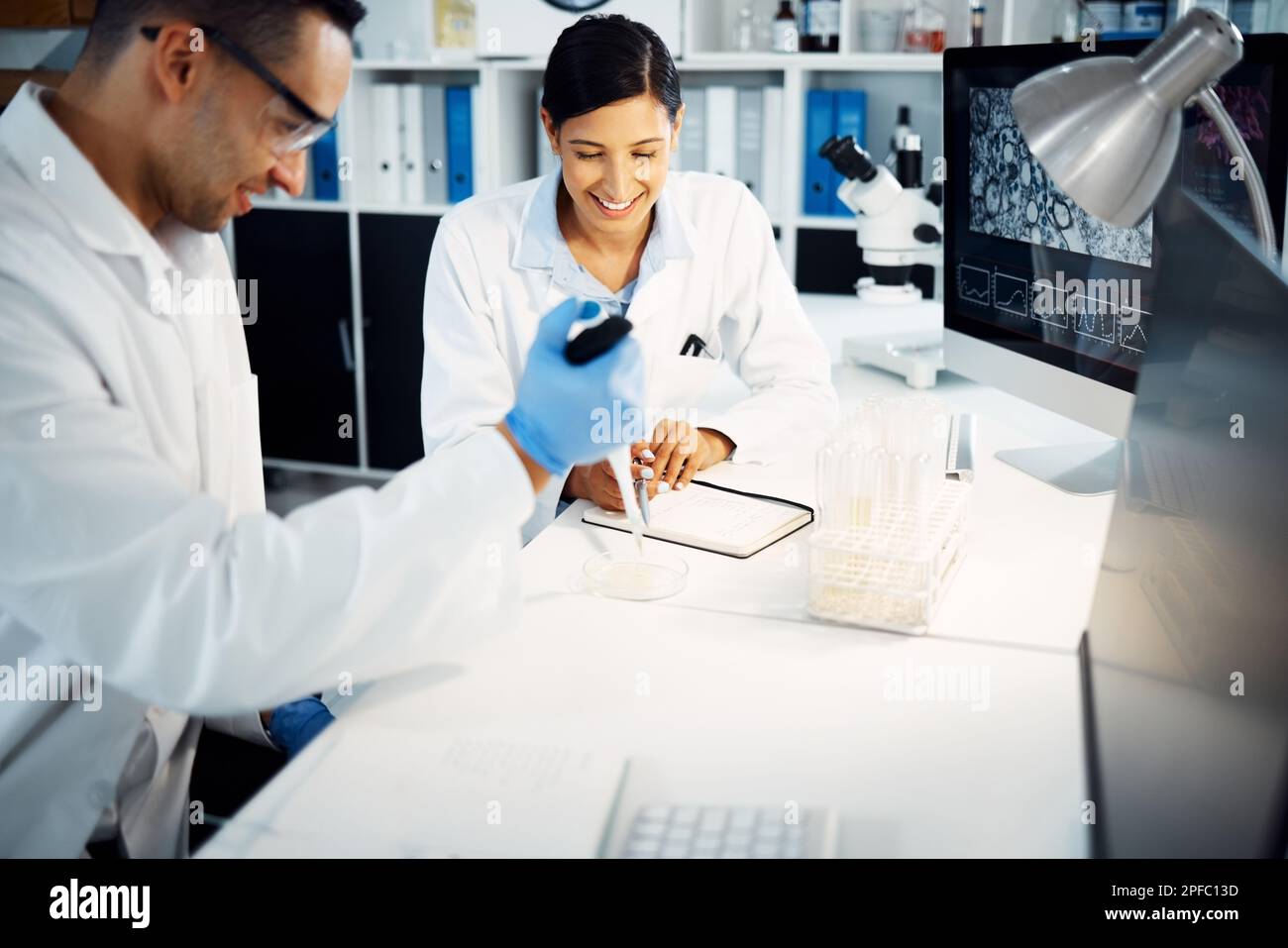 A science lab is a playground for big kids. two young scientists ...