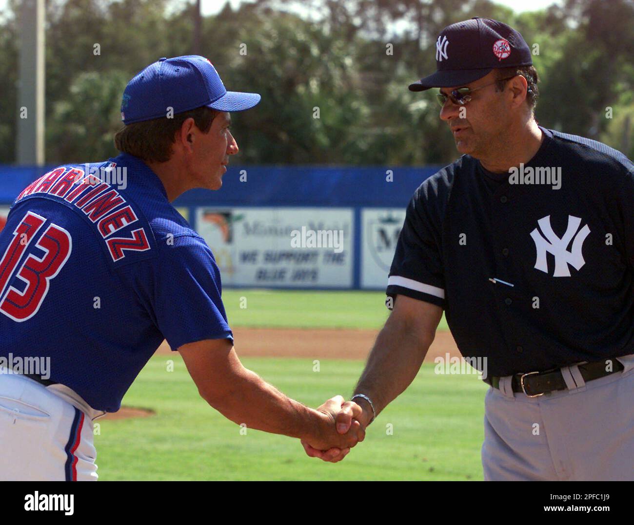 Toronto Blue Jays manager Buck Martinez, left, shakes hands with New ...