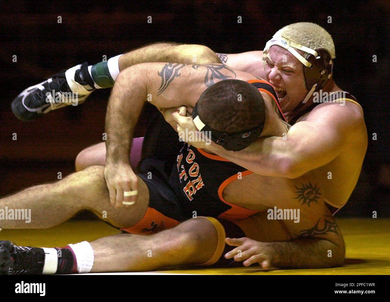 Arizona State's Kellan Fluckiger, right, takes down Oregon State's ...