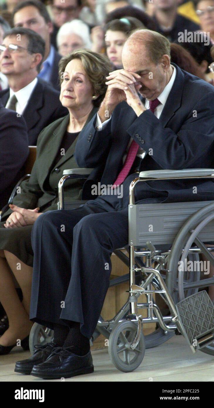 Armando Alejandre, right, and his wife, Margarita, left, pray during ...