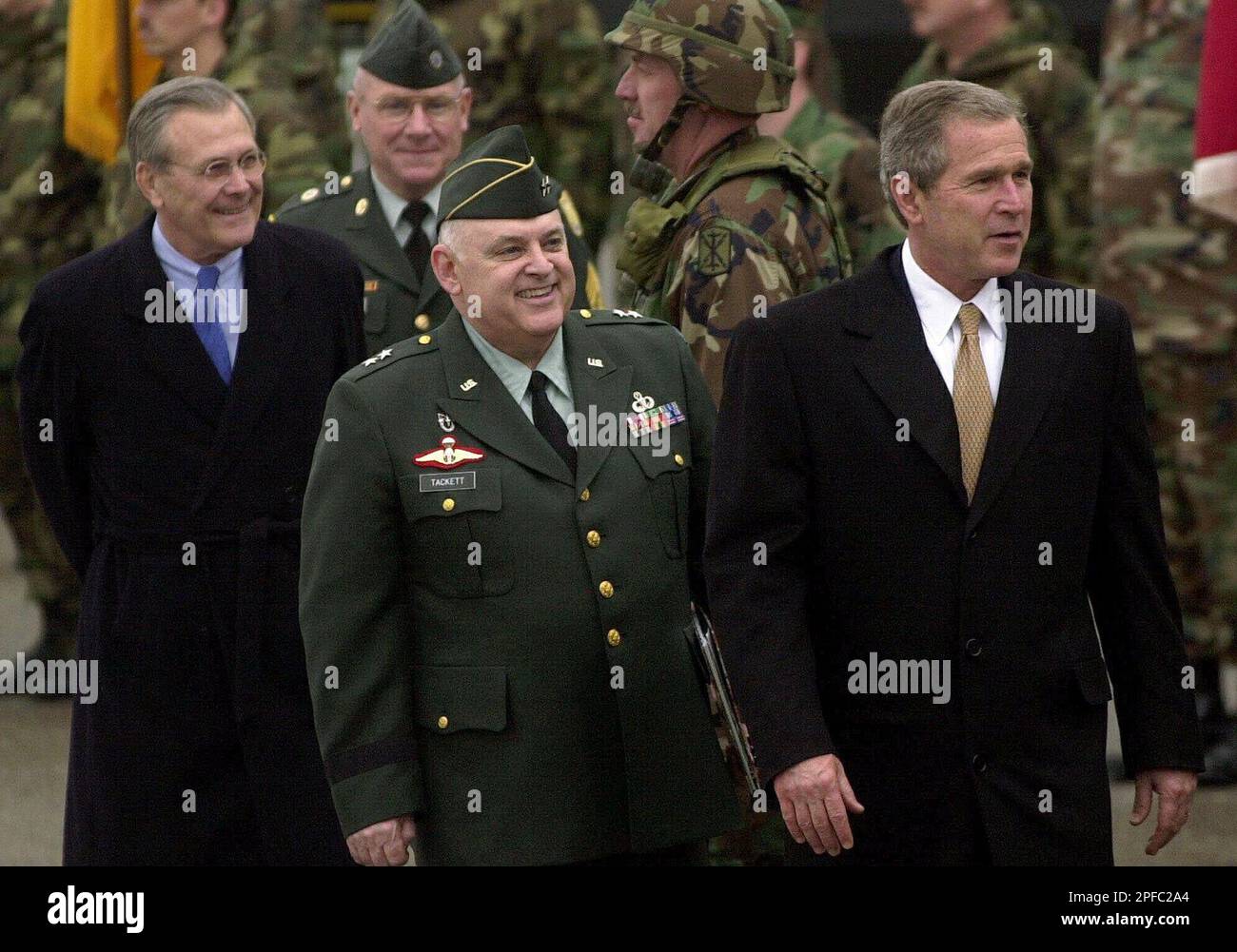 President George W. Bush, right, accompanied by Secretary of Defense ...