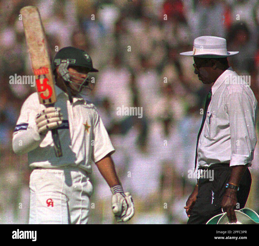 Saeed Anwar, left, acknowledges the cheers of the crowd after ...
