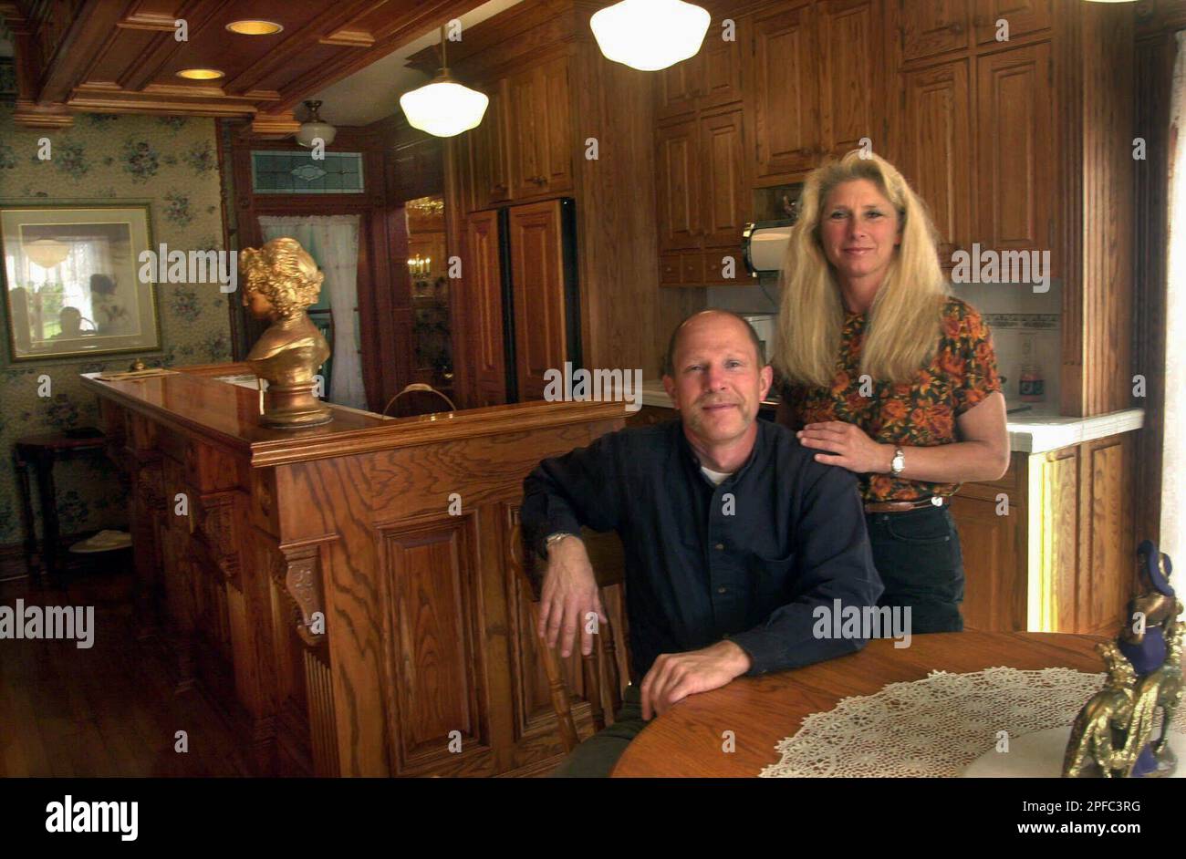 Ron and Cindy Nelson stand in their kitchen in Burton, Mich., Oct. 4 ...
