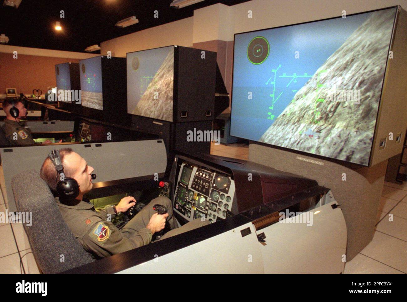 Major Mark Ponti pilots an F-15 fighter jet simulator at Kirtland Air ...