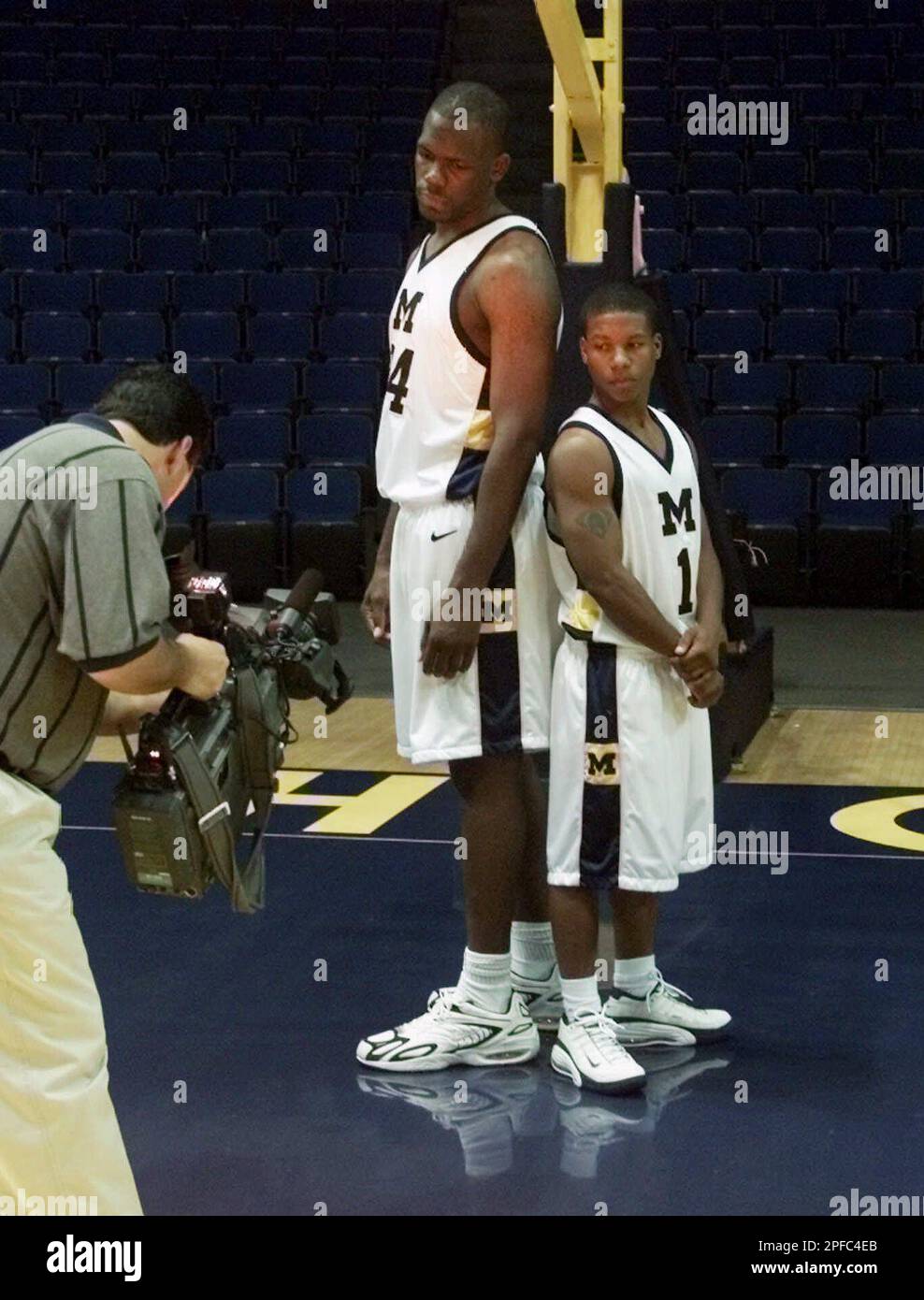 Michigan freshman center Josh Moore, left, and freshman guard Avery ...