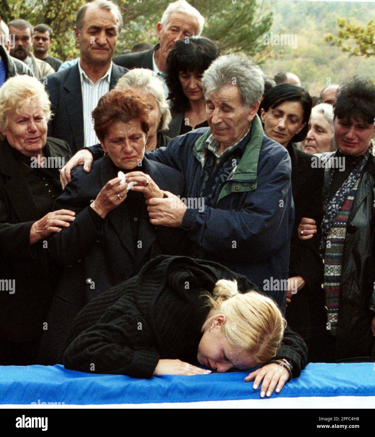 Bosnian Serb Marija Janjic, cries on the coffin of her father Janko ...