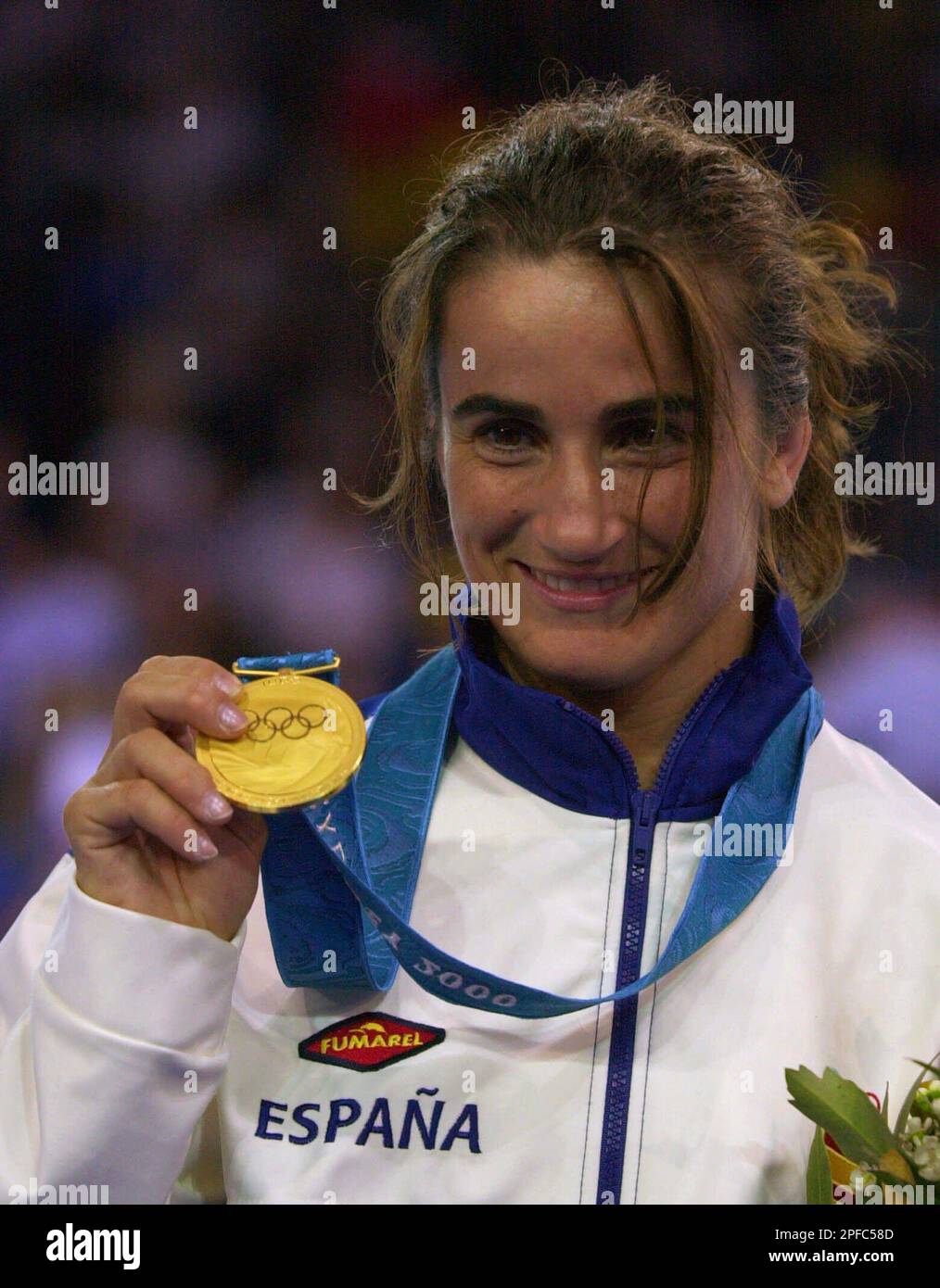 Spain's Isabel Fernandez holds her gold medal in the Judo 57kg class ...