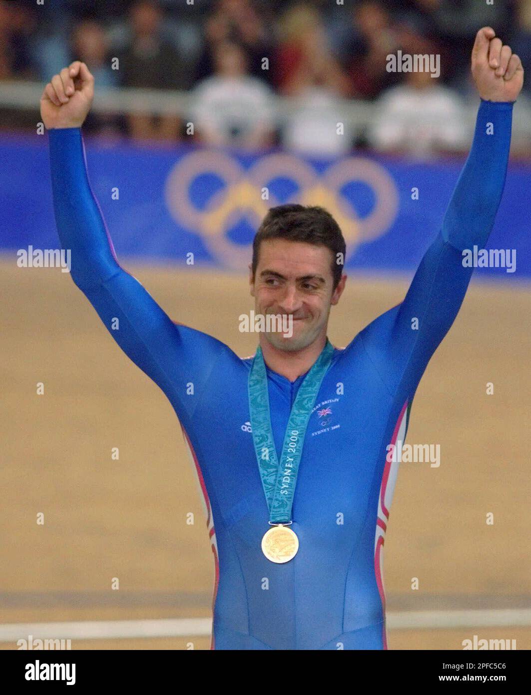 Britain's Jason Queally waves after receiving the gold medal in the ...