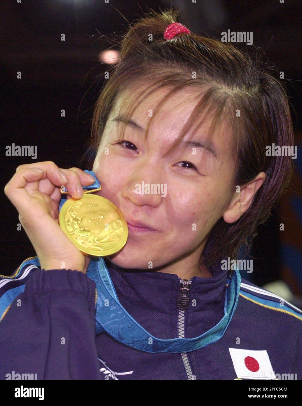 Japan's Ryoko Tamura kisses the women's 48 kg judo gold medal after the ...