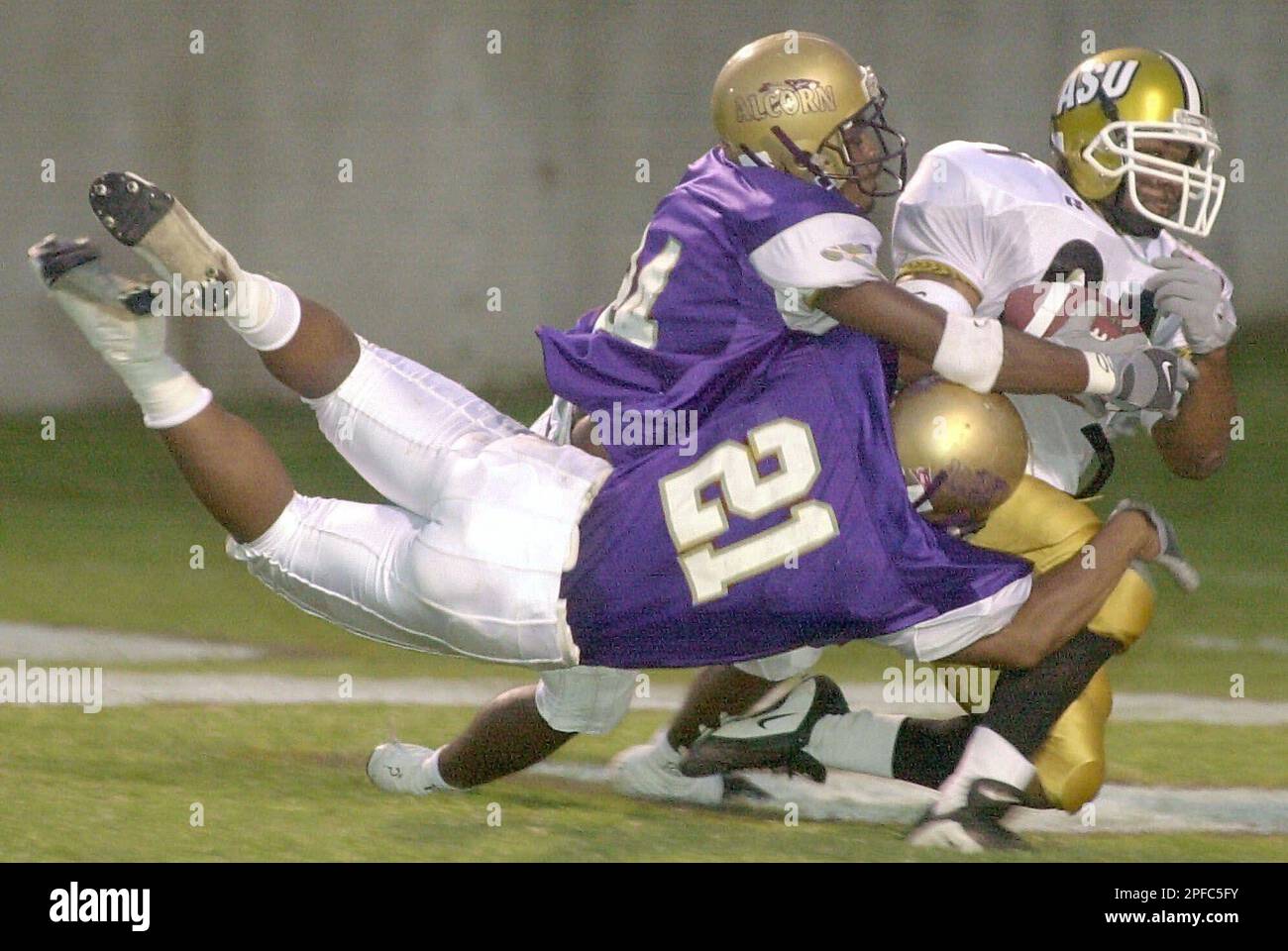 Alcorn State defenders Chris Lee, bottom, and Terrence Crimiel, top ...