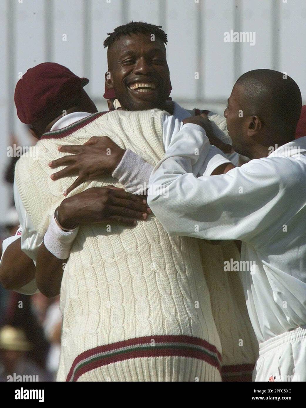 West Indies fast bowler Curtly Ambrose, facing camera, celebrates his ...