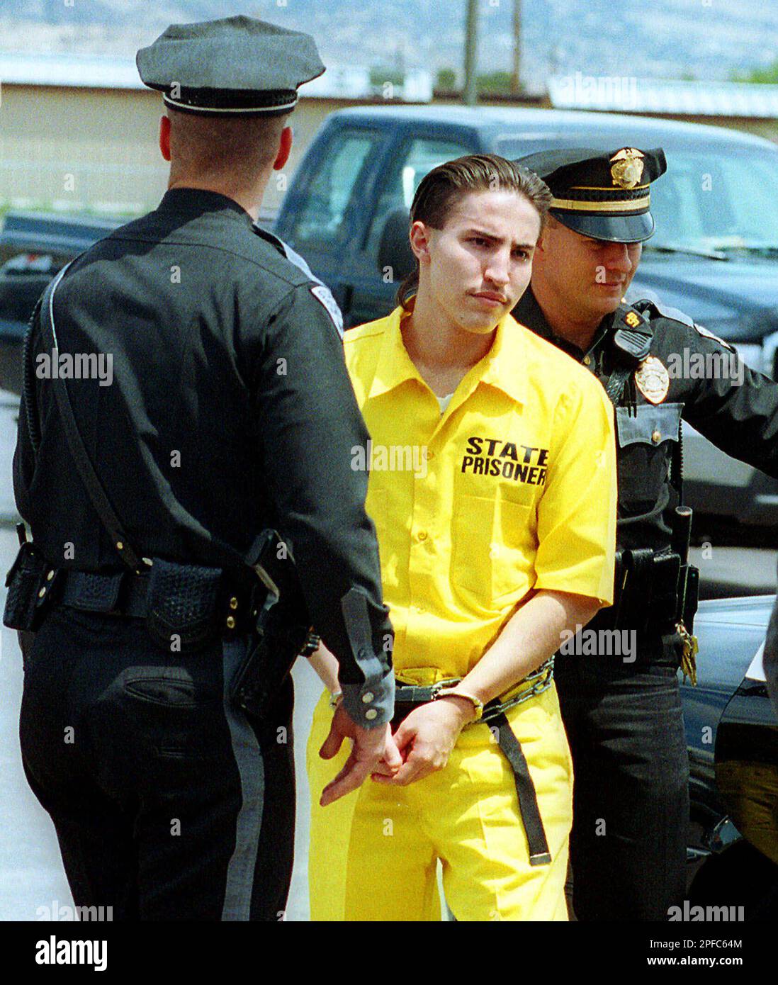 New Mexico State police officers bring Michael Archuleta, 22, to his ...