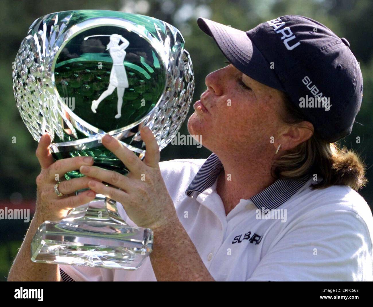 Meg Mallon from Natick, Mass., kisses the trophy following her win at 6 ...