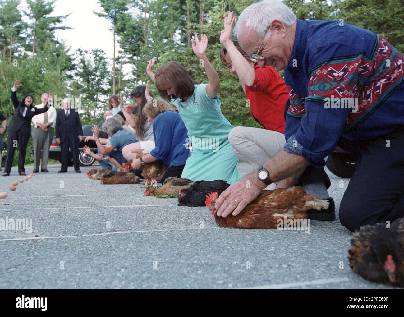 Harvey Hunt of Templeton, Calif., front, waits for his chicken to go ...