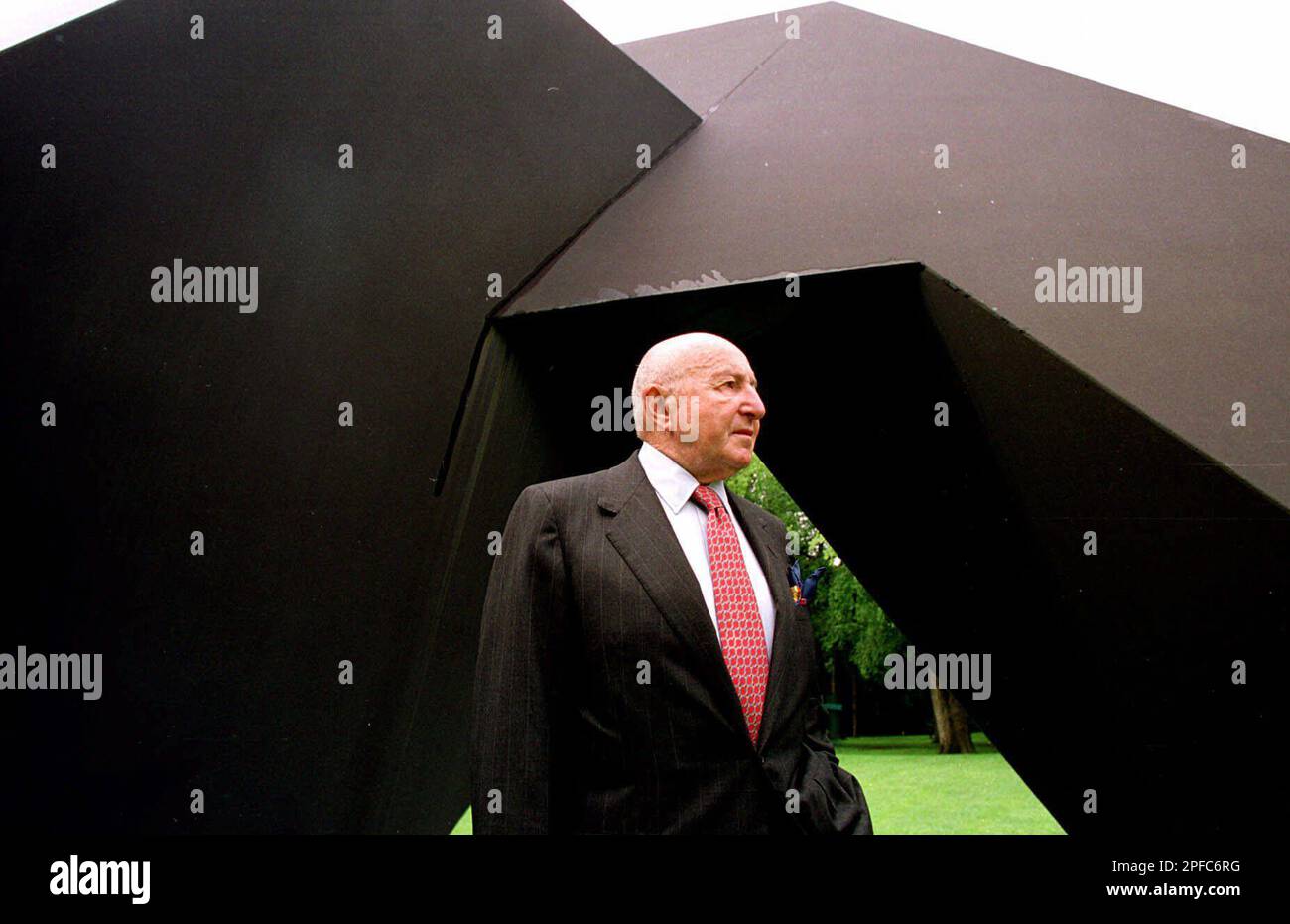 Dallas philanthropist Raymond Nasher stands near "The Snake is Out ...