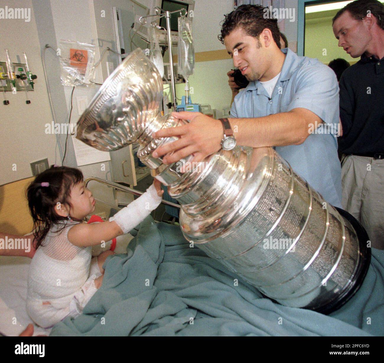 Three-year-old Angeline Evans of English Bay, Alaska, reaches out to ...