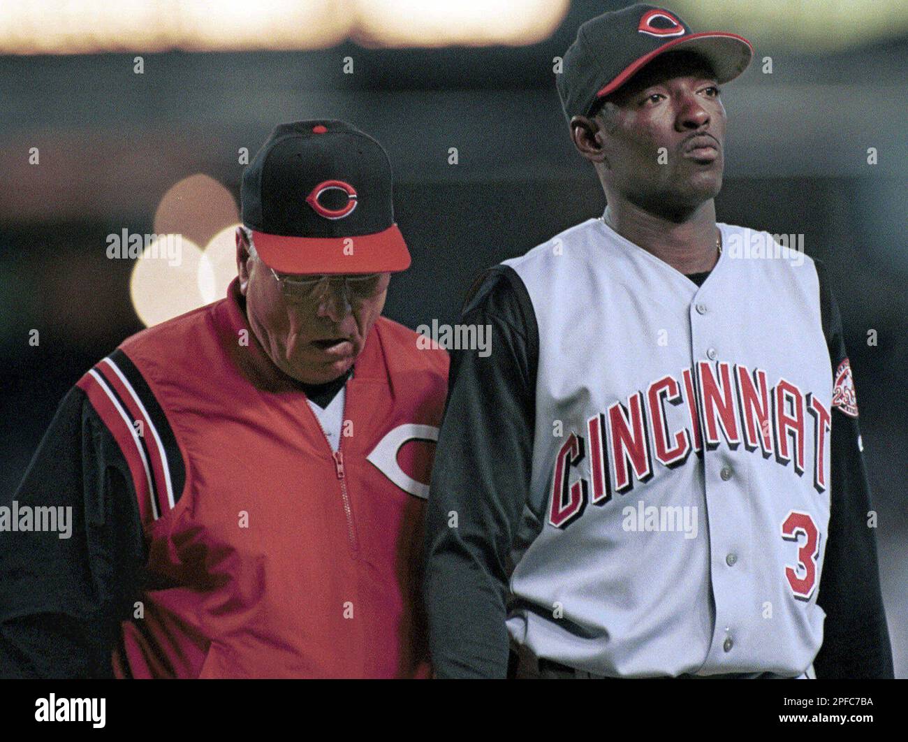 Cincinnati Reds manager Jack McKeon escorts Reds' relief pitcher Manny ...